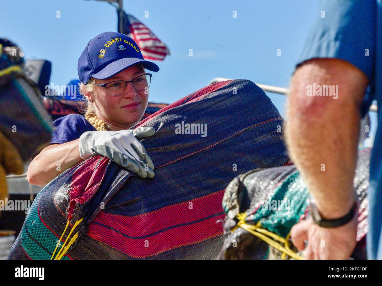 Bales of illegal drugs, worth an estimated $475 million, are offloaded ...