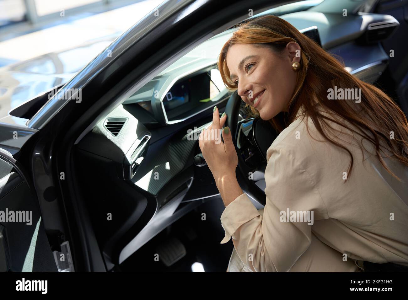 Smiling female motorist hi-res stock photography and images - Alamy