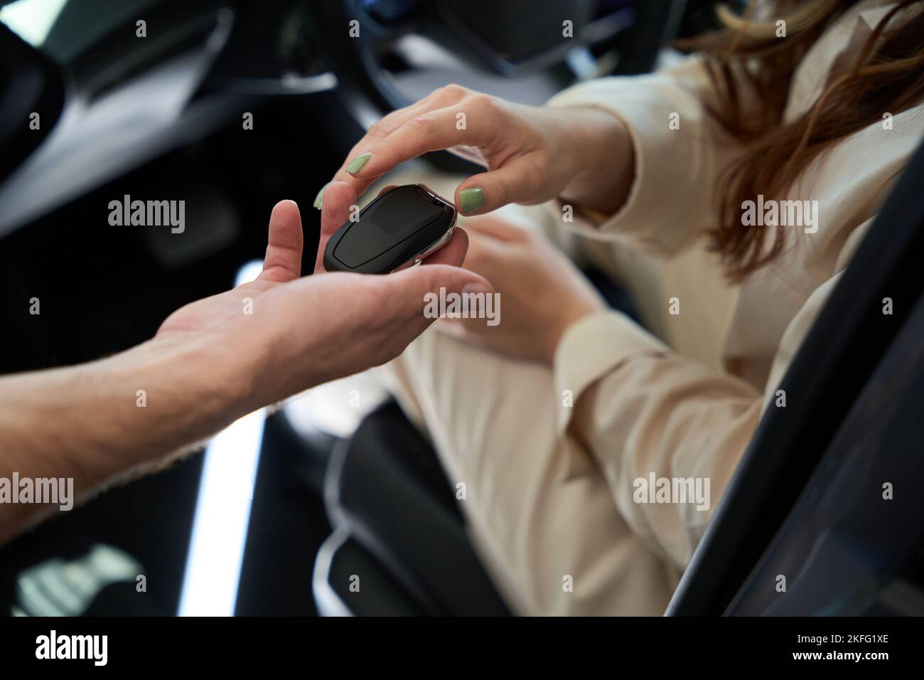 Female customer receiving car key hi-res stock photography and images ...