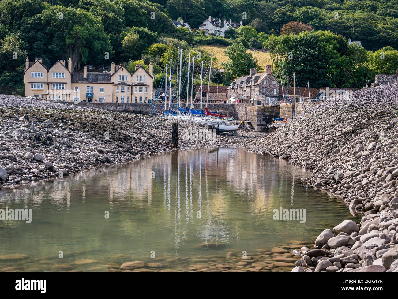 A sea inlet into Porlock Weir with yachts at low tide on the Bristol ...