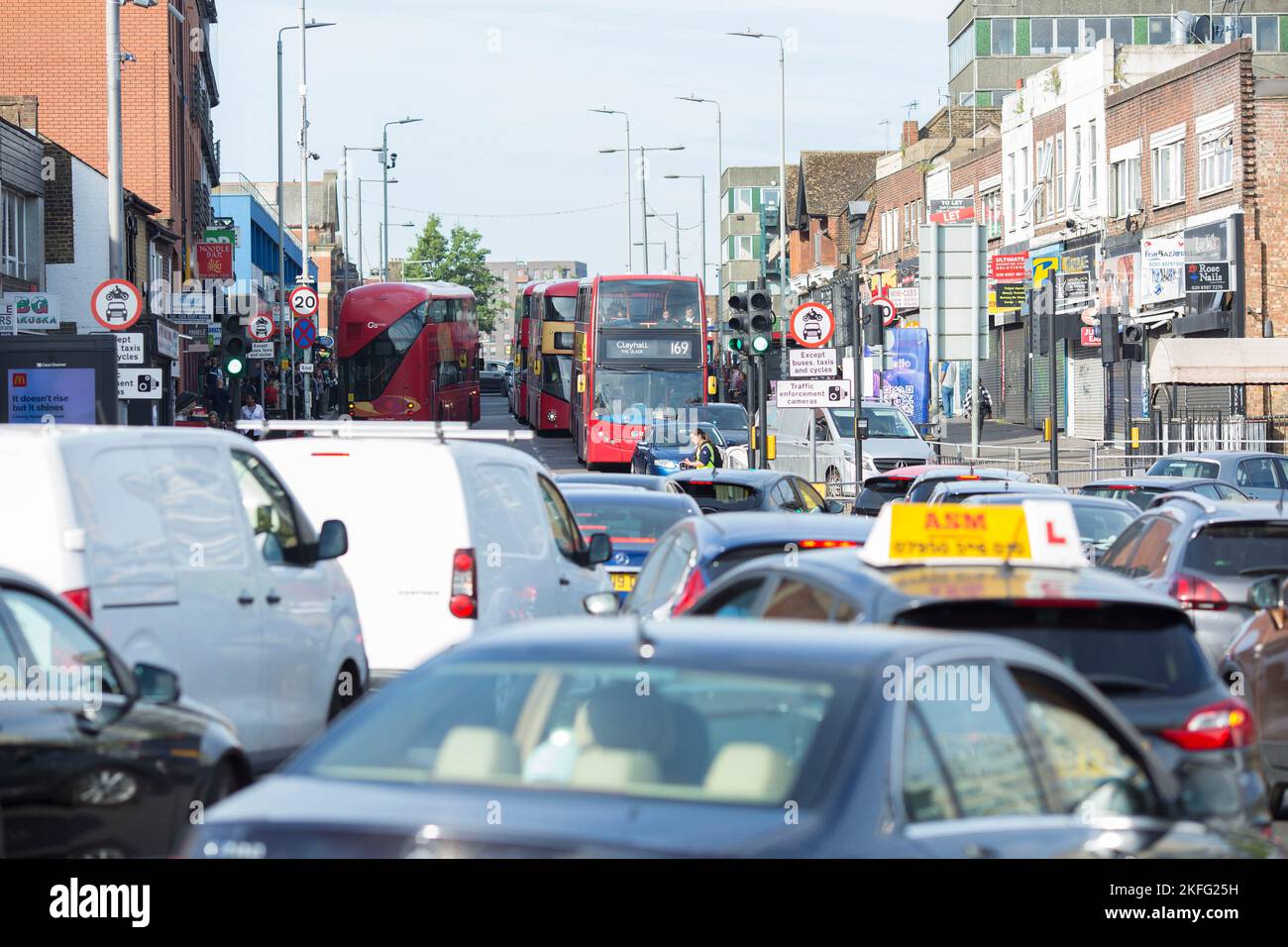 Double-decker buses are seen in and around a congested roundabout in ...