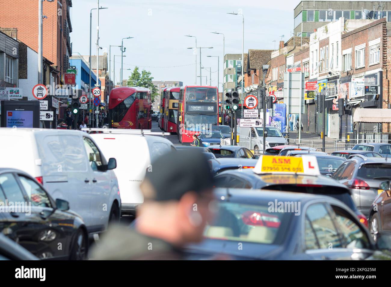 Double-decker buses are seen in and around a congested roundabout in ...