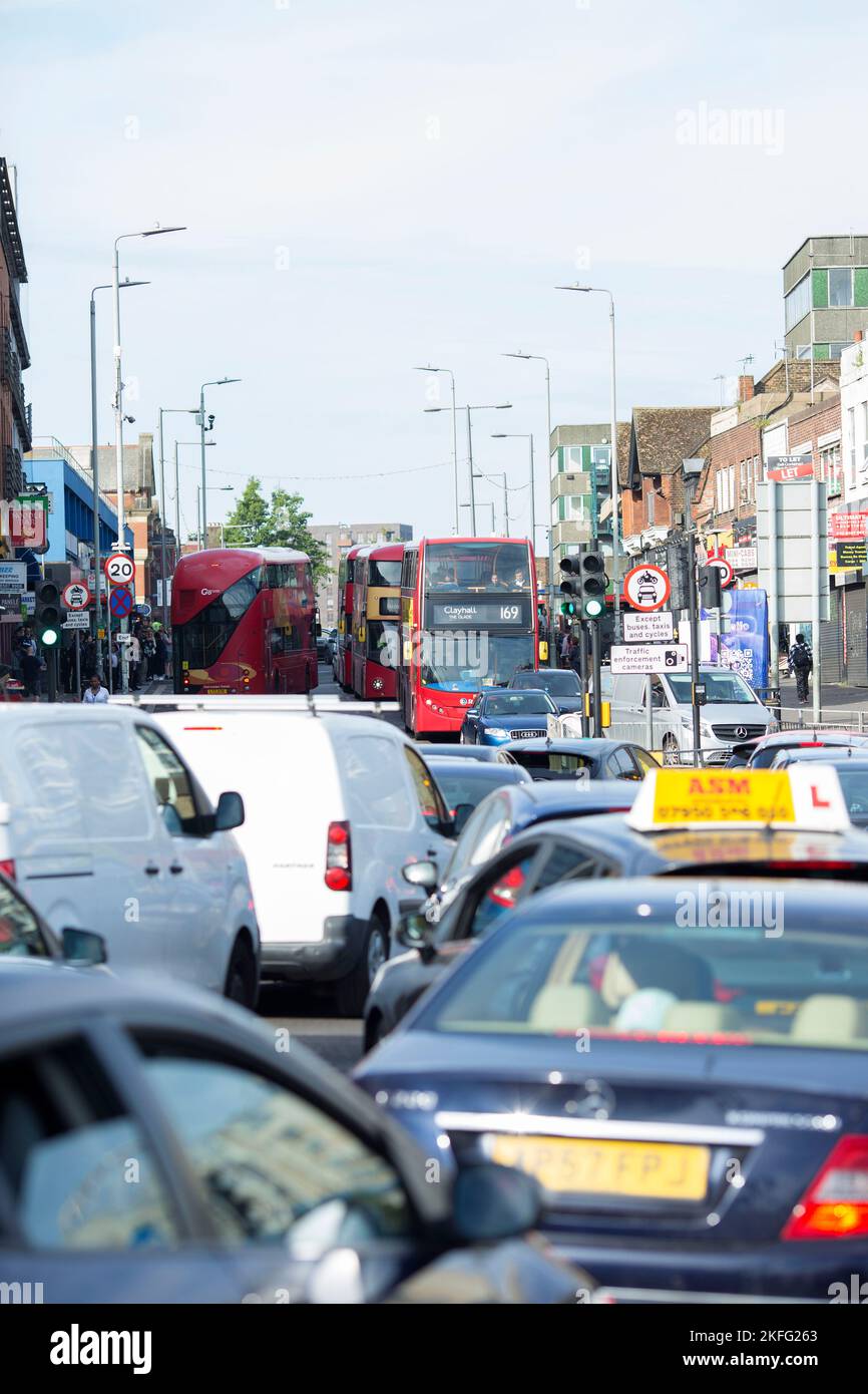 Double-decker buses are seen in and around a congested roundabout in ...
