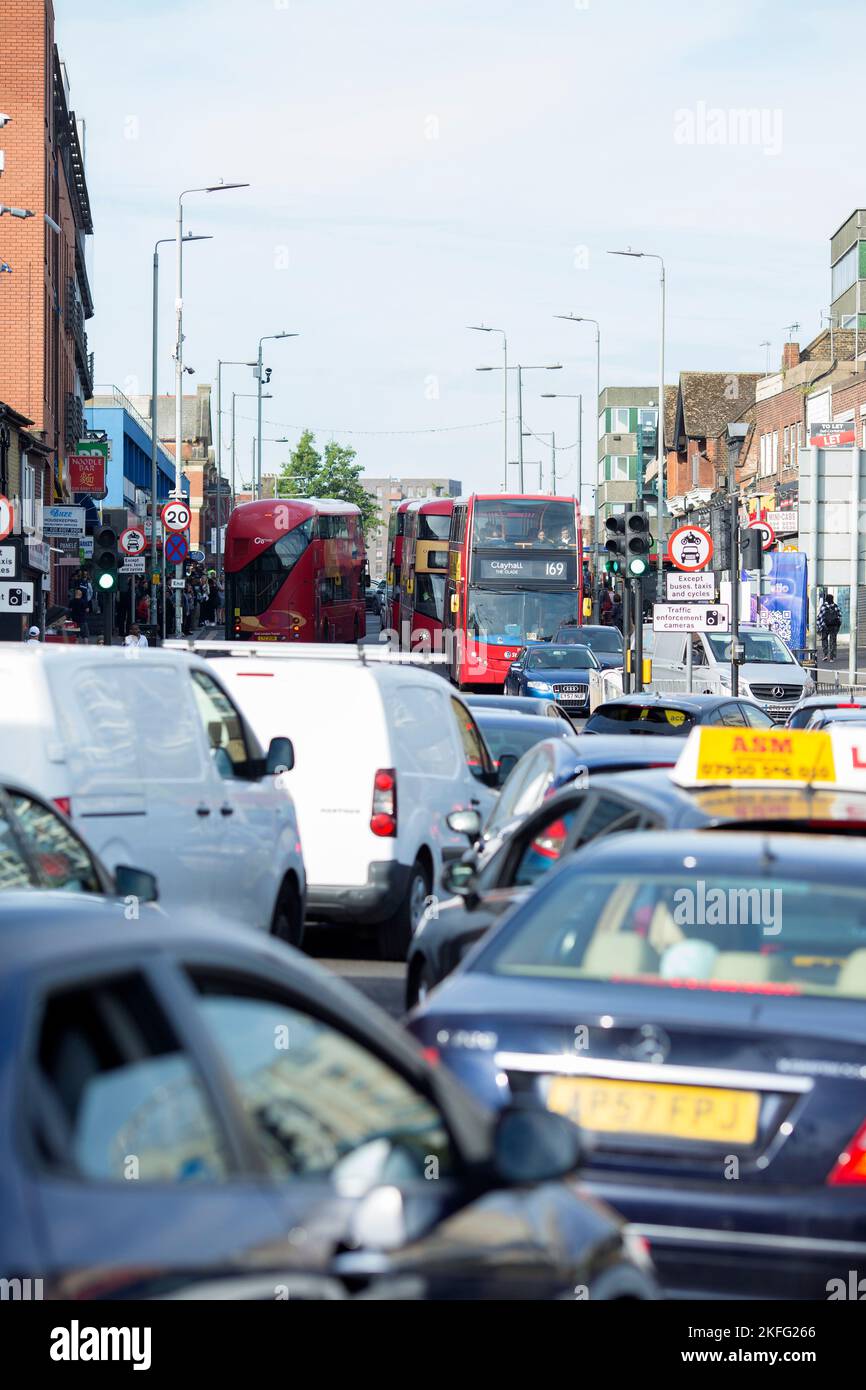 Double-decker buses are seen in and around a congested roundabout in ...