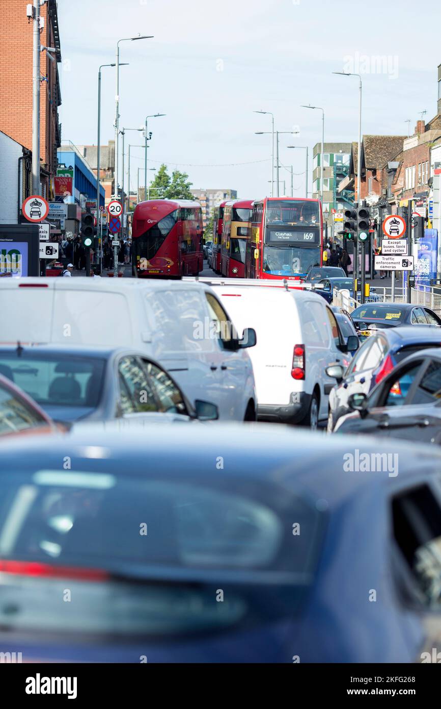 Double-decker buses are seen in and around a congested roundabout in ...