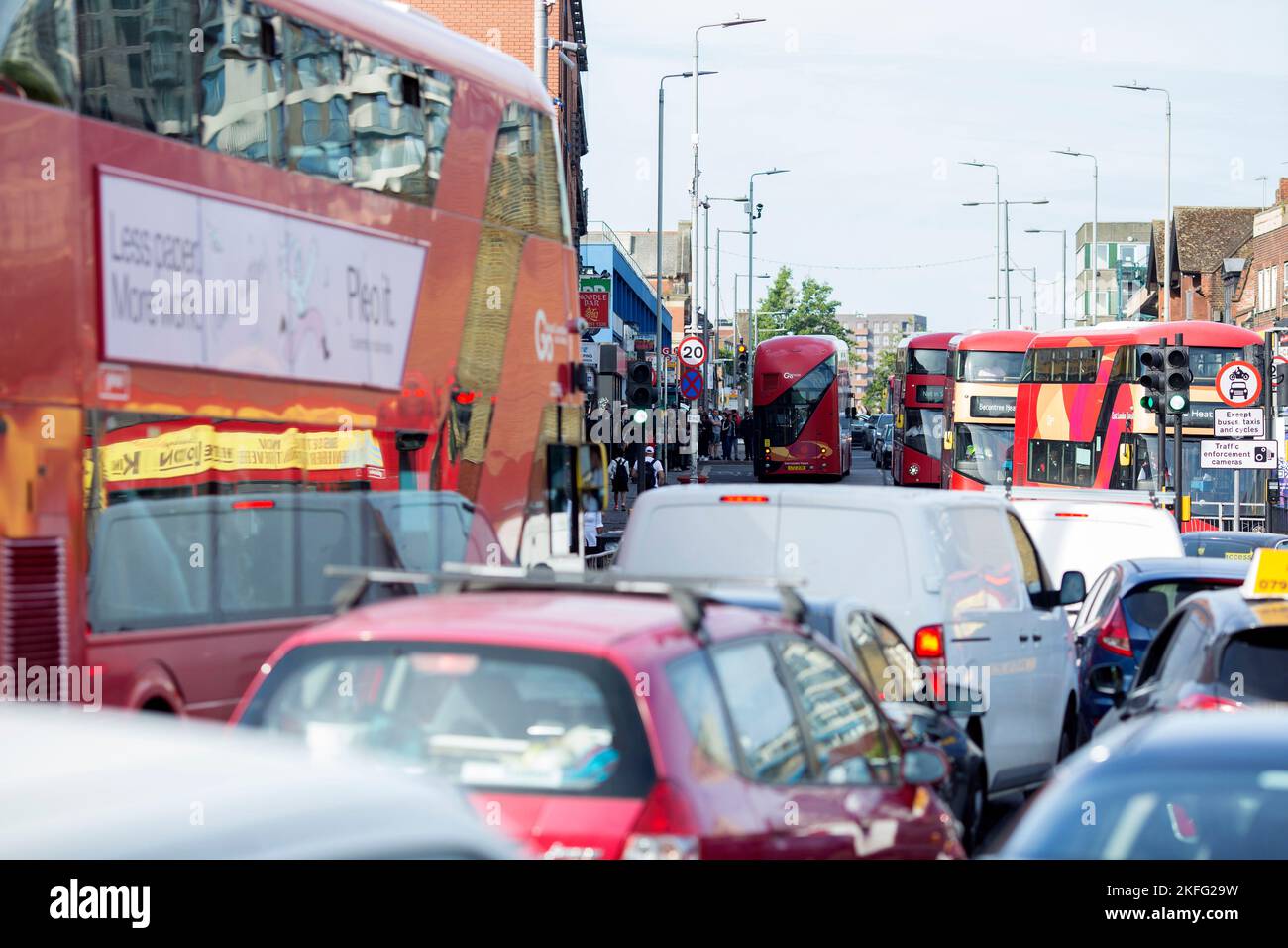 Double-decker buses are seen in and around a congested roundabout in ...