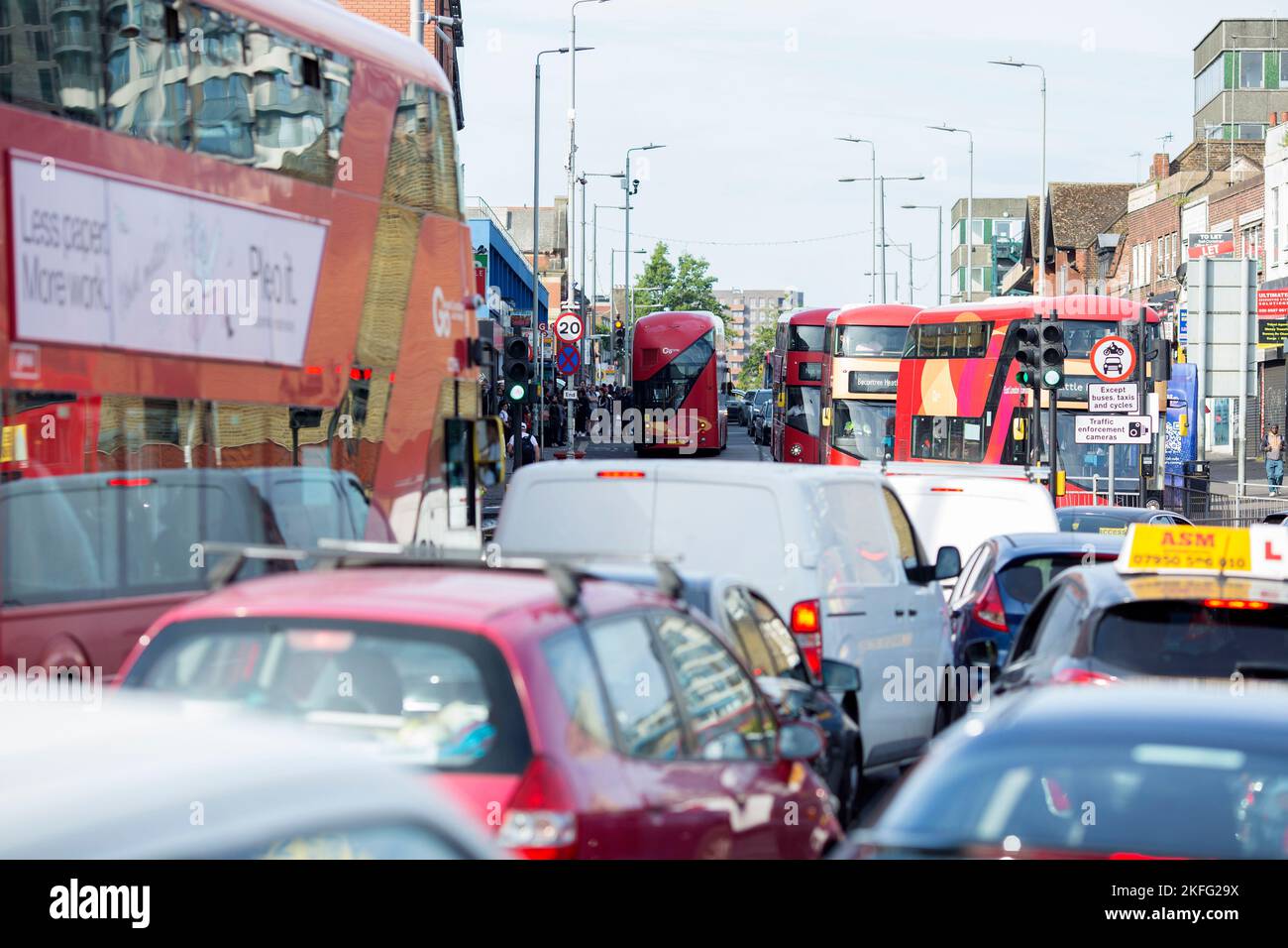 Double-decker buses are seen in and around a congested roundabout in ...