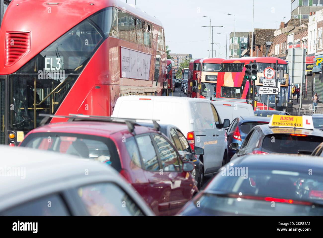 Double-decker buses are seen in and around a congested roundabout in ...