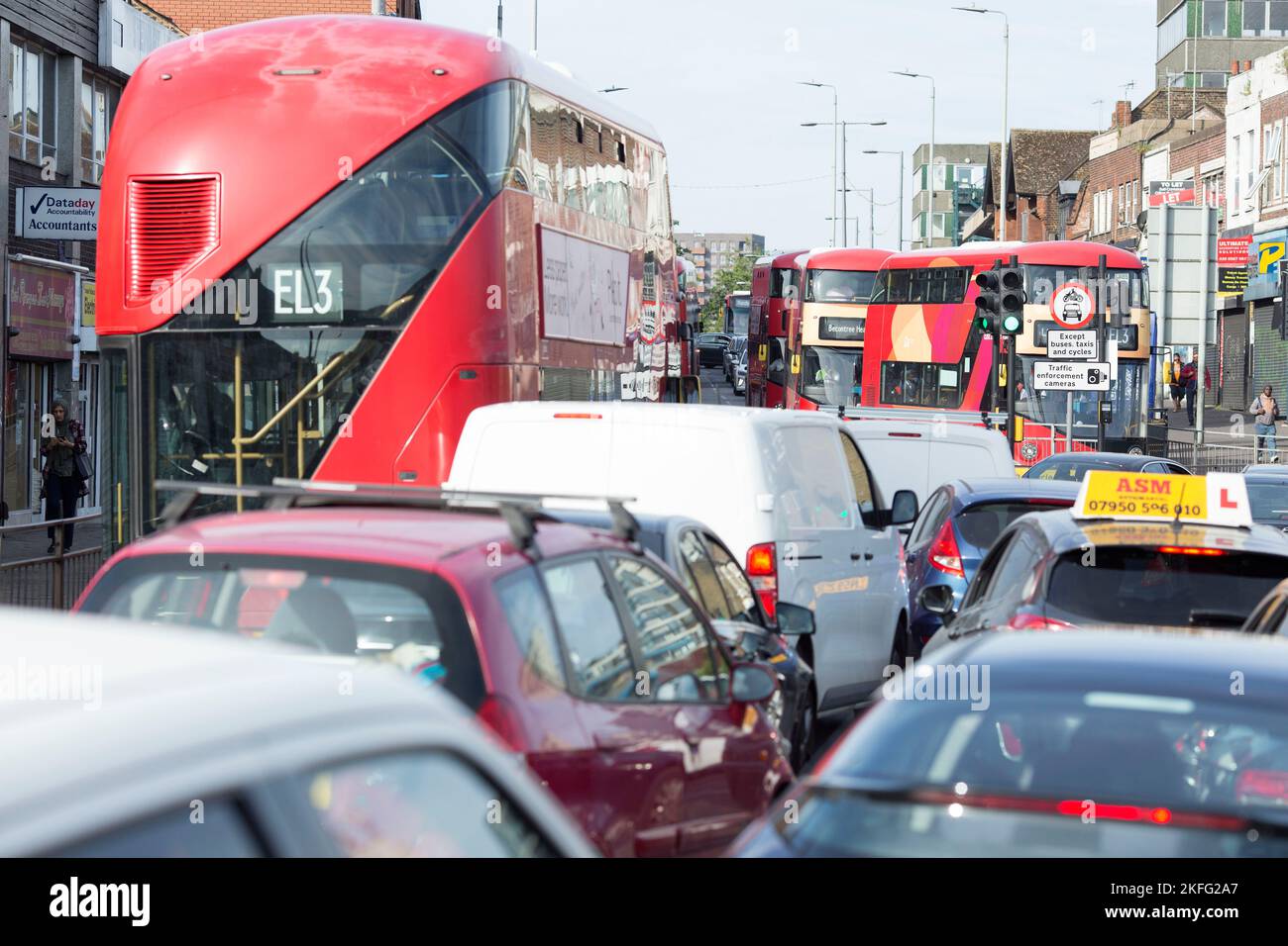Double-decker buses are seen in and around a congested roundabout in ...