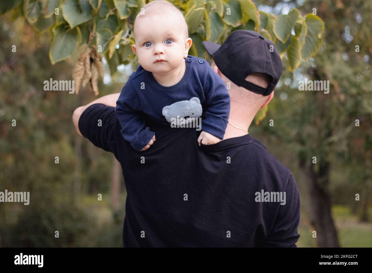 Happy father with his child outdoors Stock Photo - Alamy