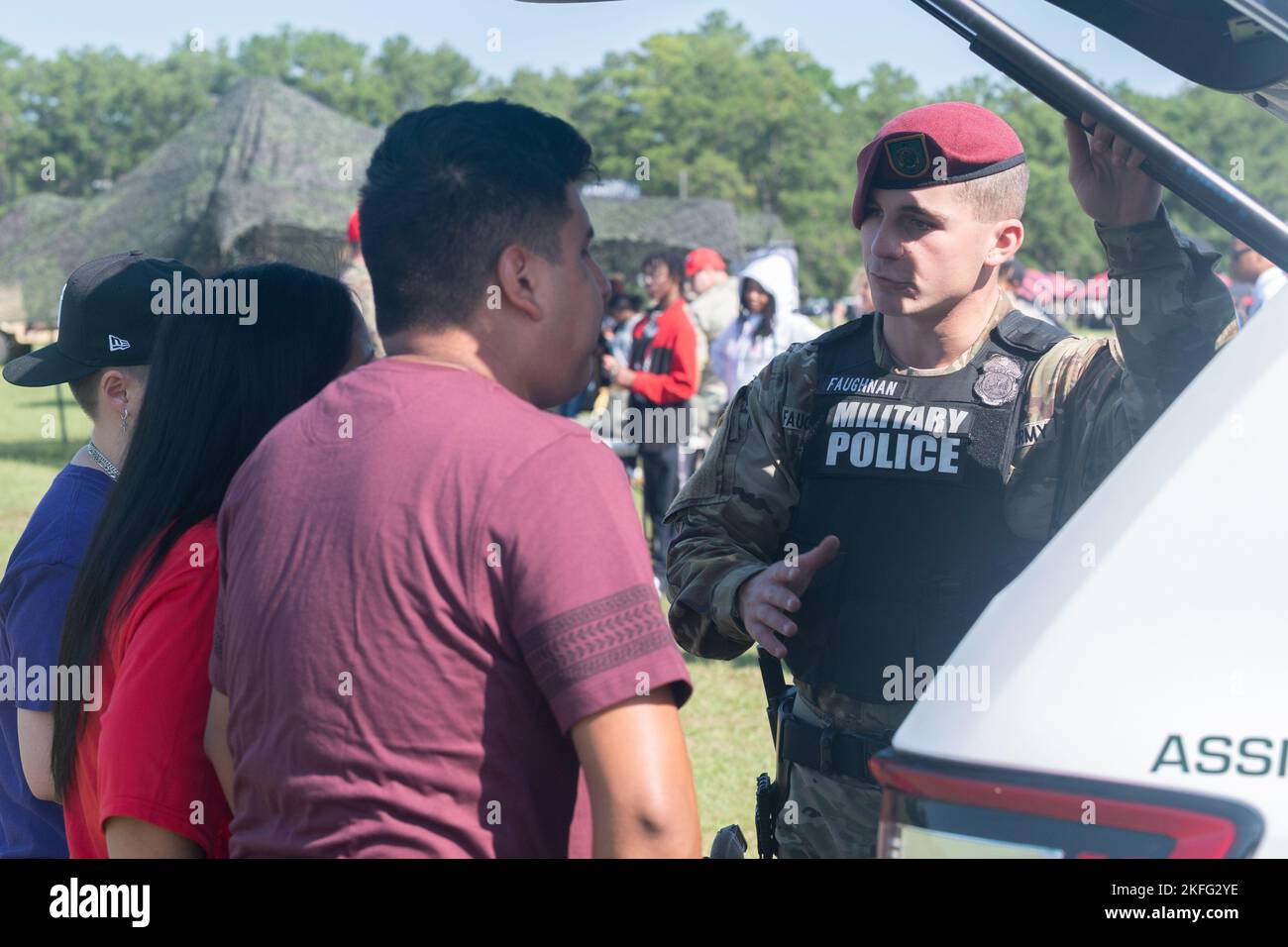 A military police Soldier with 16th MP Brigade speaks with school ...