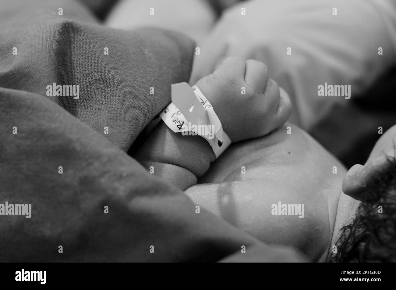 A newborn baby who is being cleaned up after birth Stock Photo - Alamy