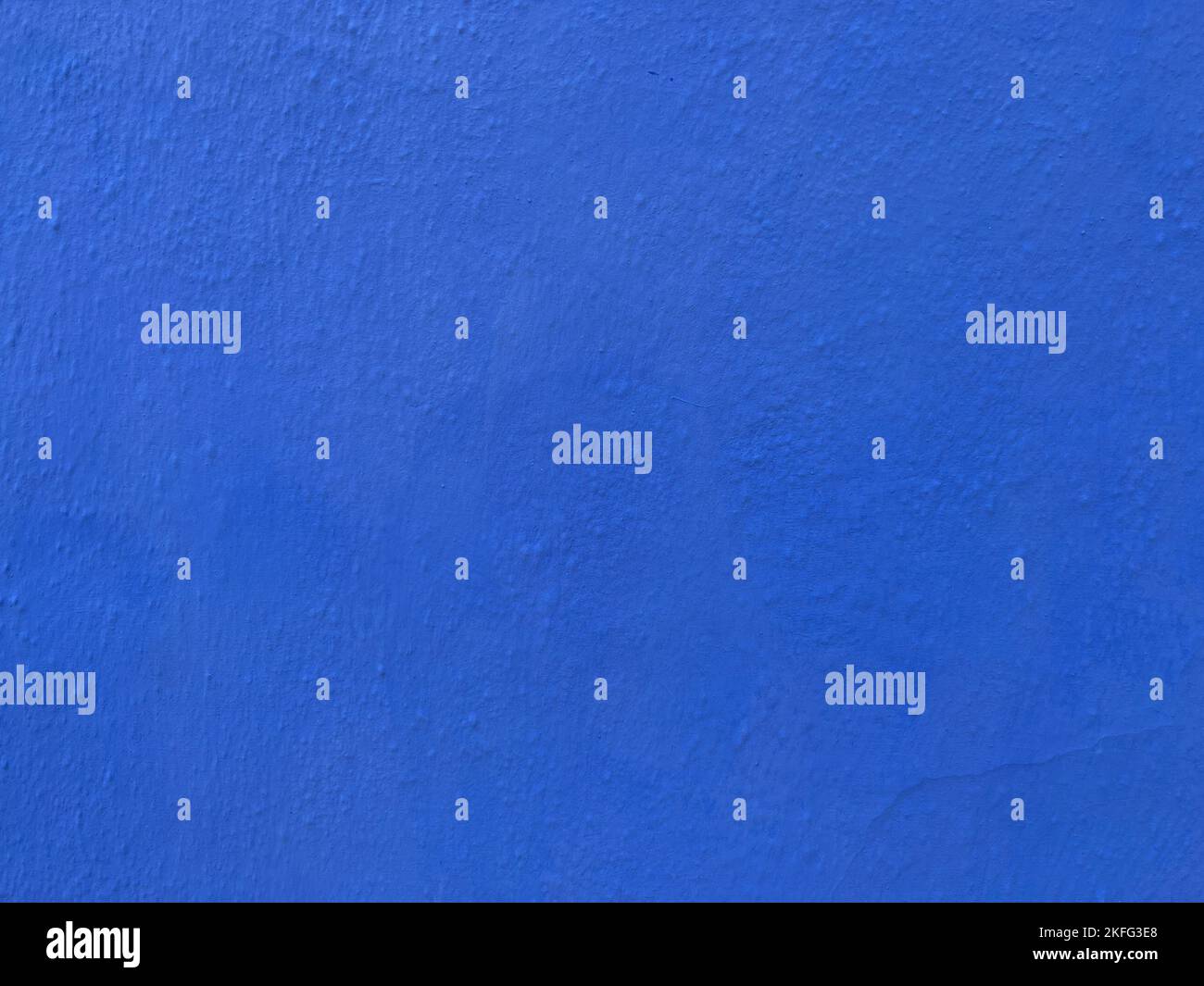 Bright blue textured wall background Stock Photo - Alamy