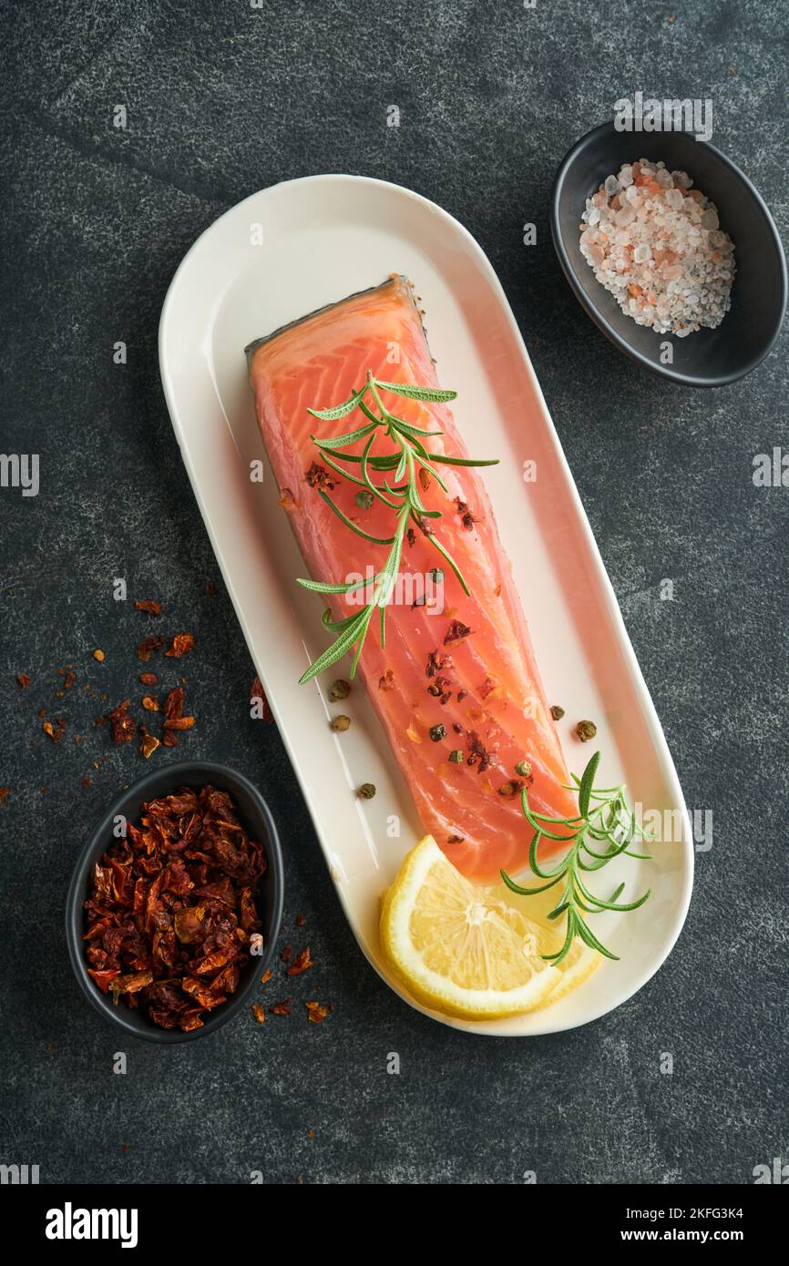 Salmon fish piece. Fresh raw salmon fish piece on marble board stand ...