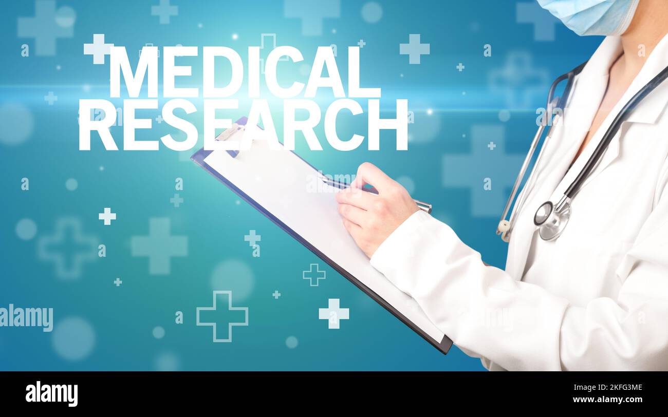 doctor writes notes on the clipboard Stock Photo - Alamy