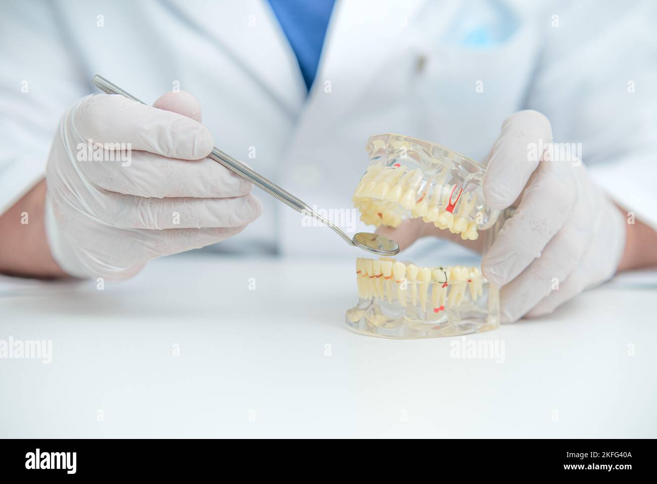 doctor shows the instrument on caries in the teeth Stock Photo - Alamy