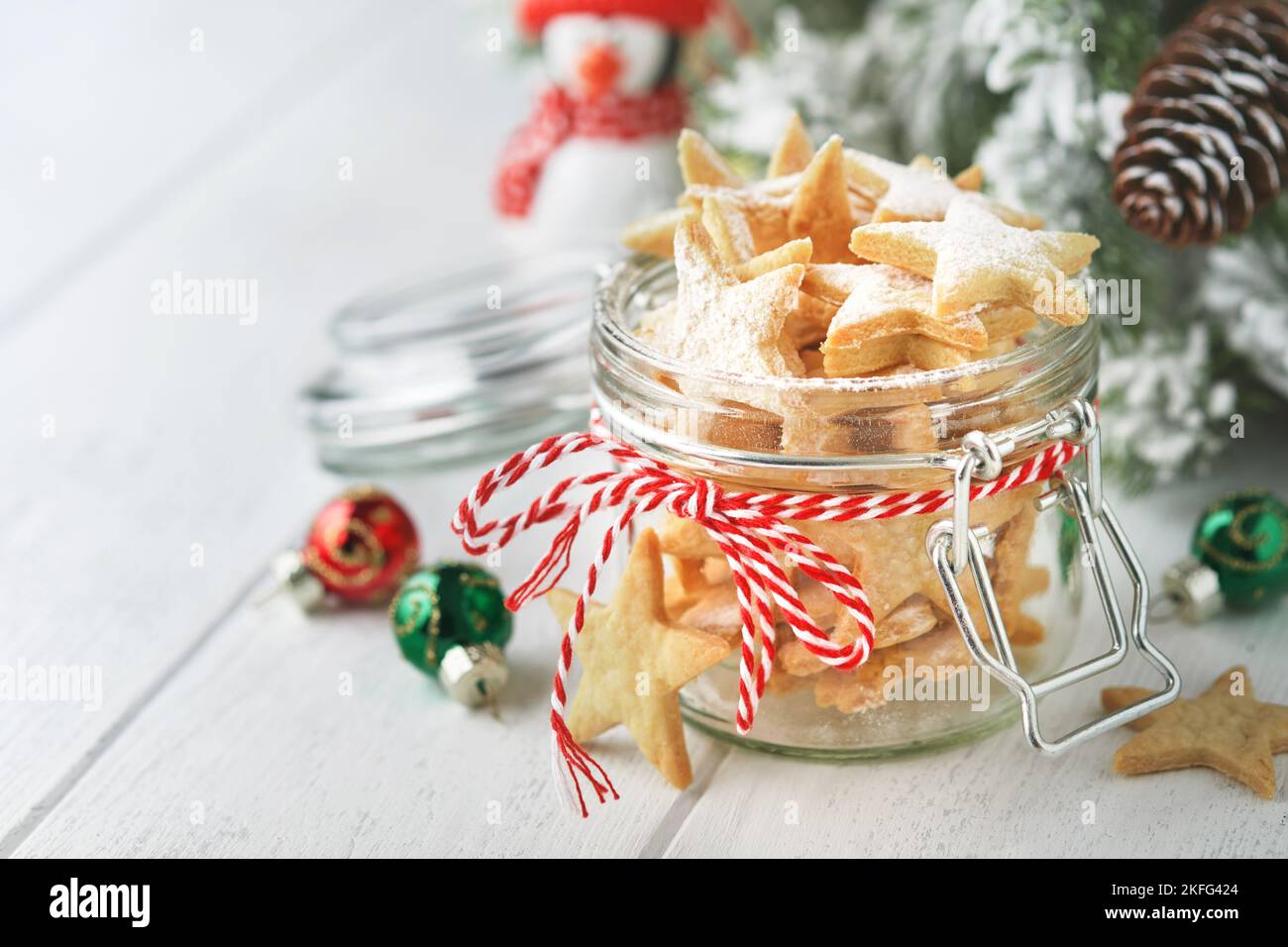 Christmas shortbread cookies or gingerbread stars with red ribbon ...