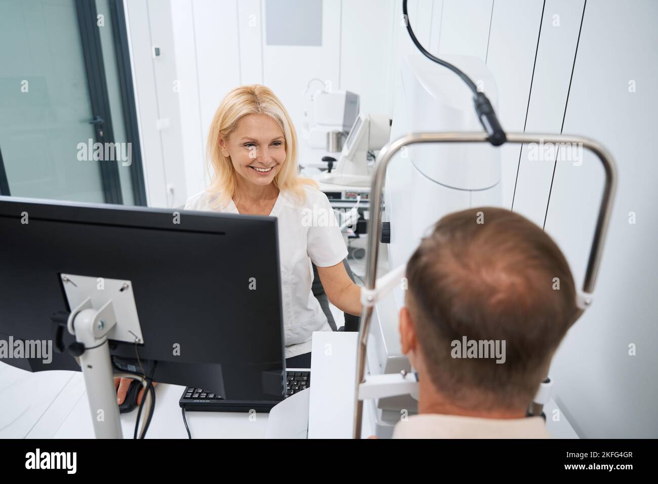 Nurse receiving patient in her office in hospital Stock Photo - Alamy