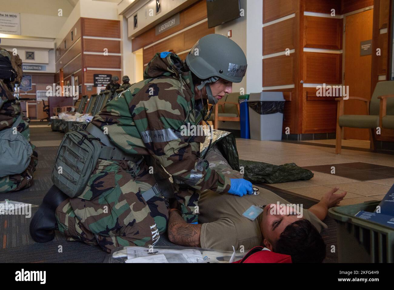 U.S. Air Force Airmen from the 36th Medical Group checks a patient's ...