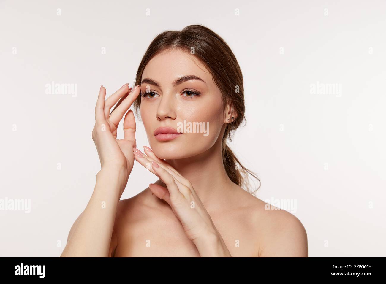 Portrait of young beautiful woman with perfect smooth skin isolated ...