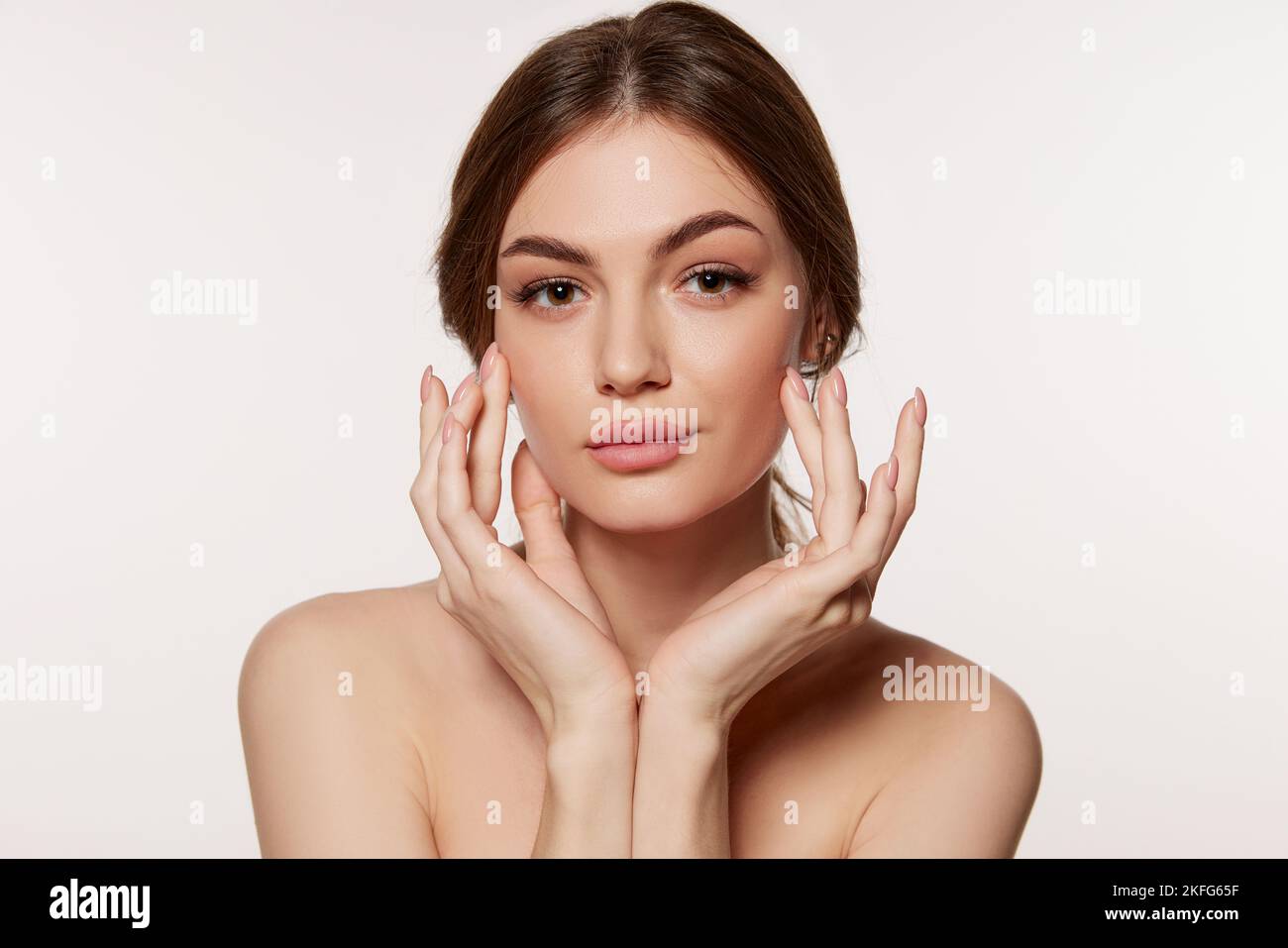 Portrait of young beautiful woman with perfect smooth skin isolated ...