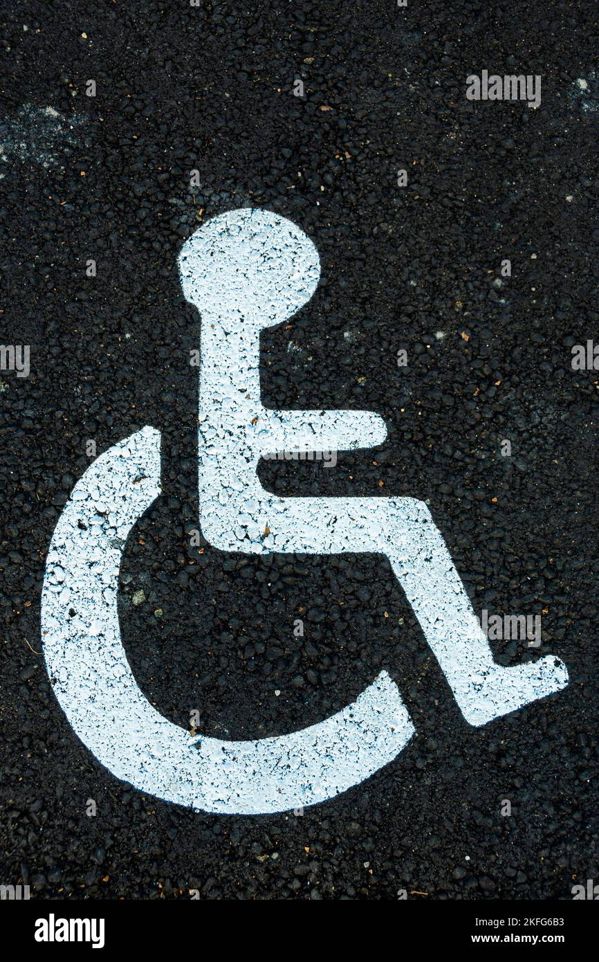 Vertical shot of a disabled person sign on the asphalt Stock Photo - Alamy