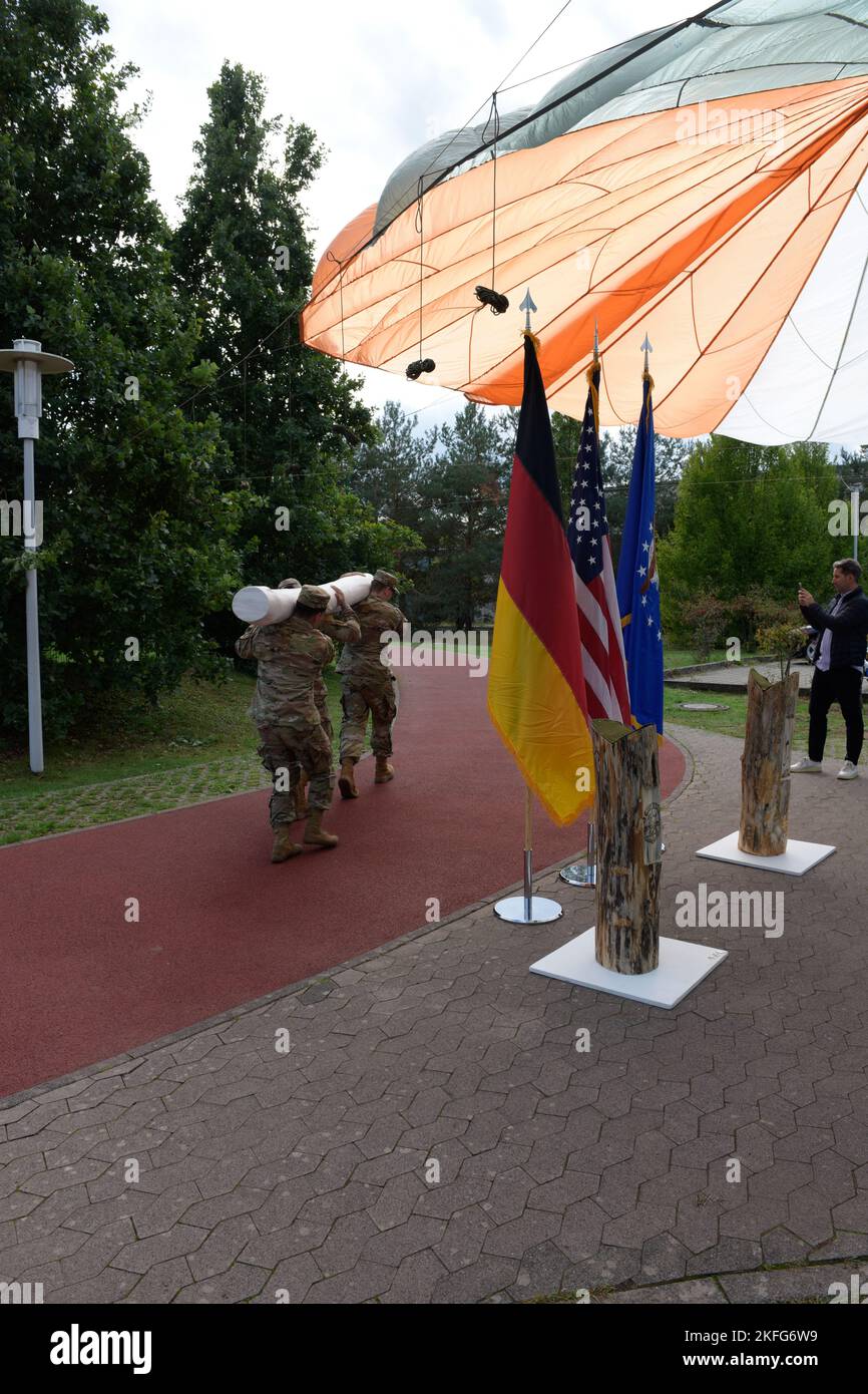U.S. Air Force Airmen carry a log during a 24-hour prisoner of war ...
