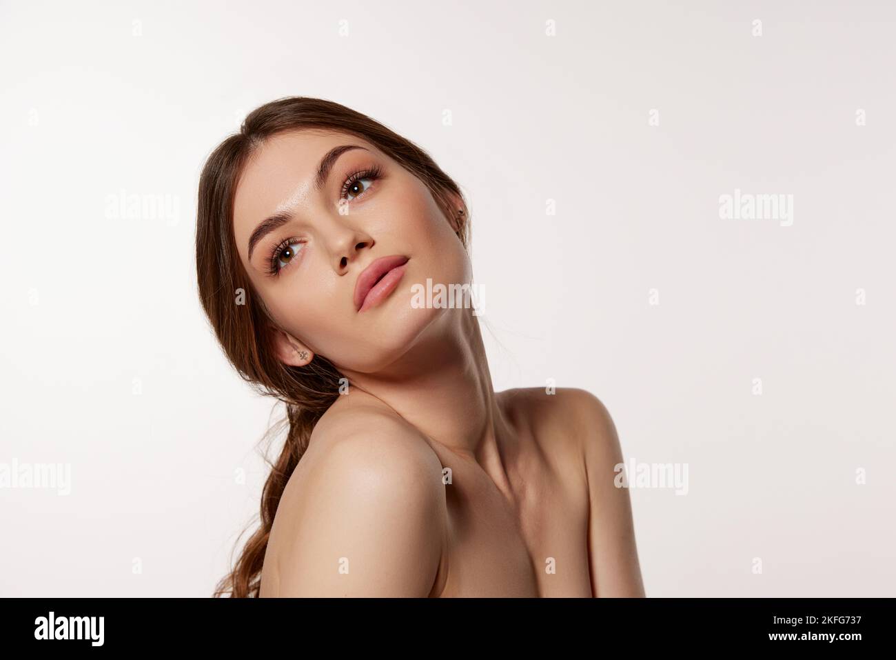 Portrait of young beautiful woman with perfect smooth skin isolated ...