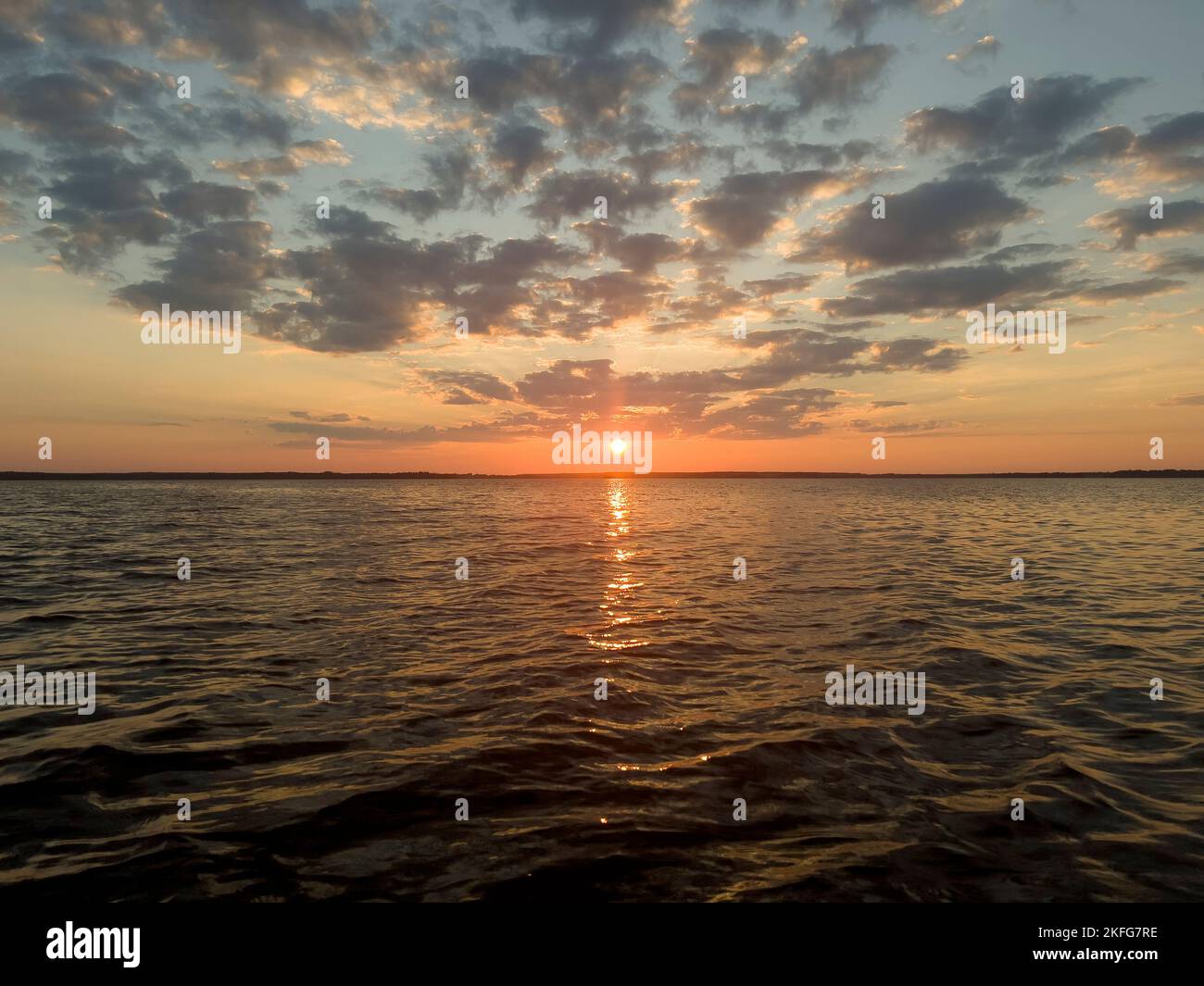 Water surface. View of a Sunset sky background. Dramatic gold sunset ...