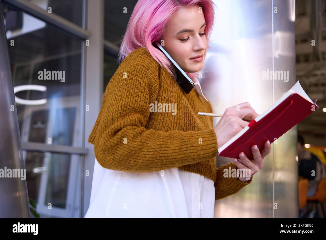 Stylish woman making notes hi-res stock photography and images - Alamy