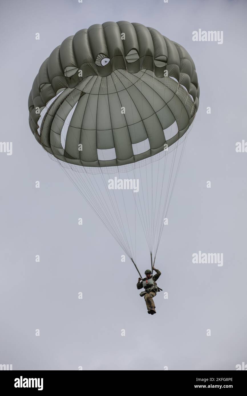 A German Paratrooper conducts an Airborne jump out of a C-130 aircraft ...