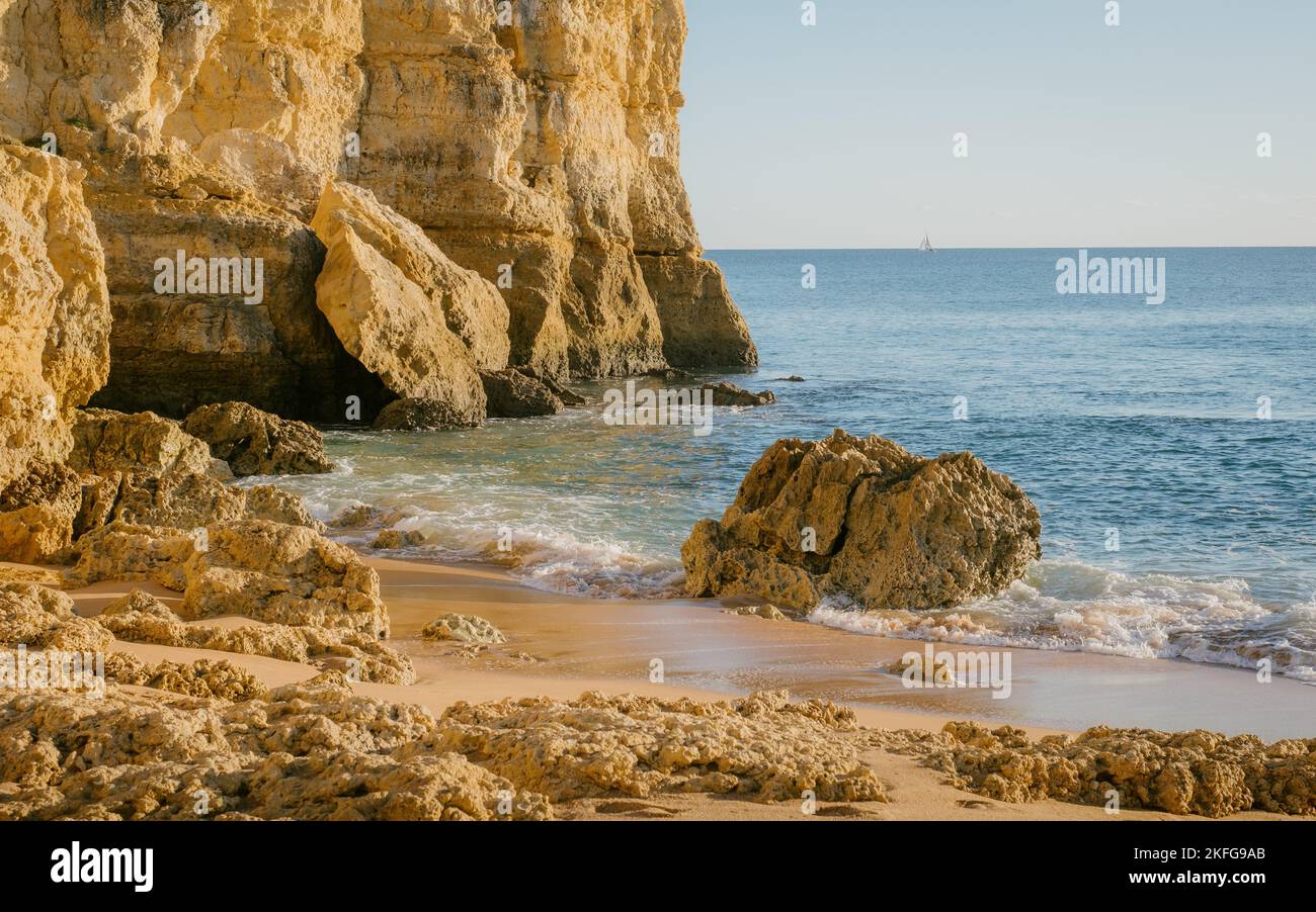 A big rocks in the seashore with waves hitting the rocks Stock Photo ...