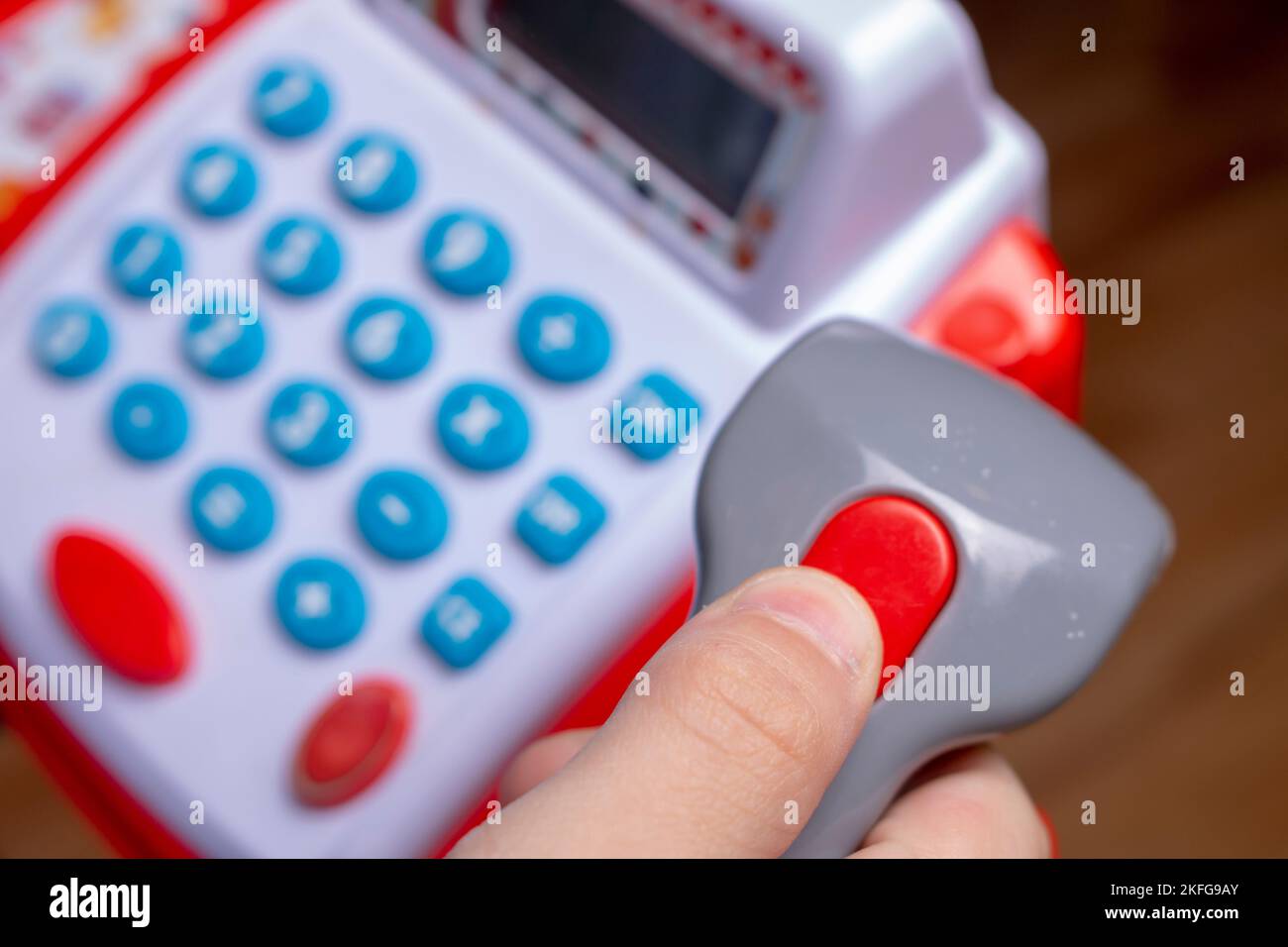 kid holding cash register in the shop, counting money Stock Photo - Alamy