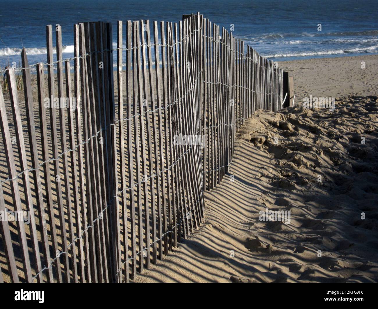 A fence line marks a dune crossing at 69th Street in Ocean City ...
