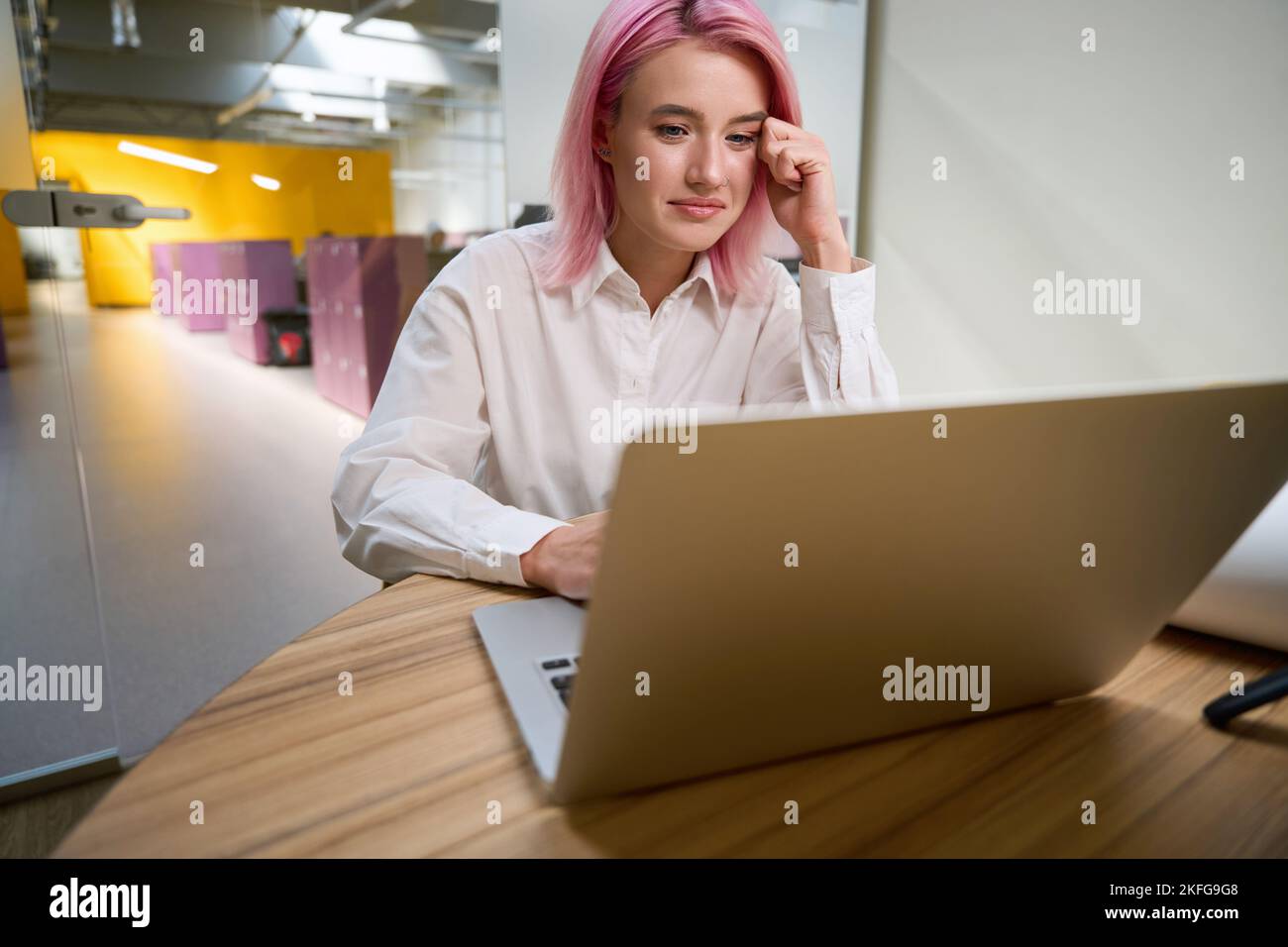 Serious woman working in the office online Stock Photo - Alamy