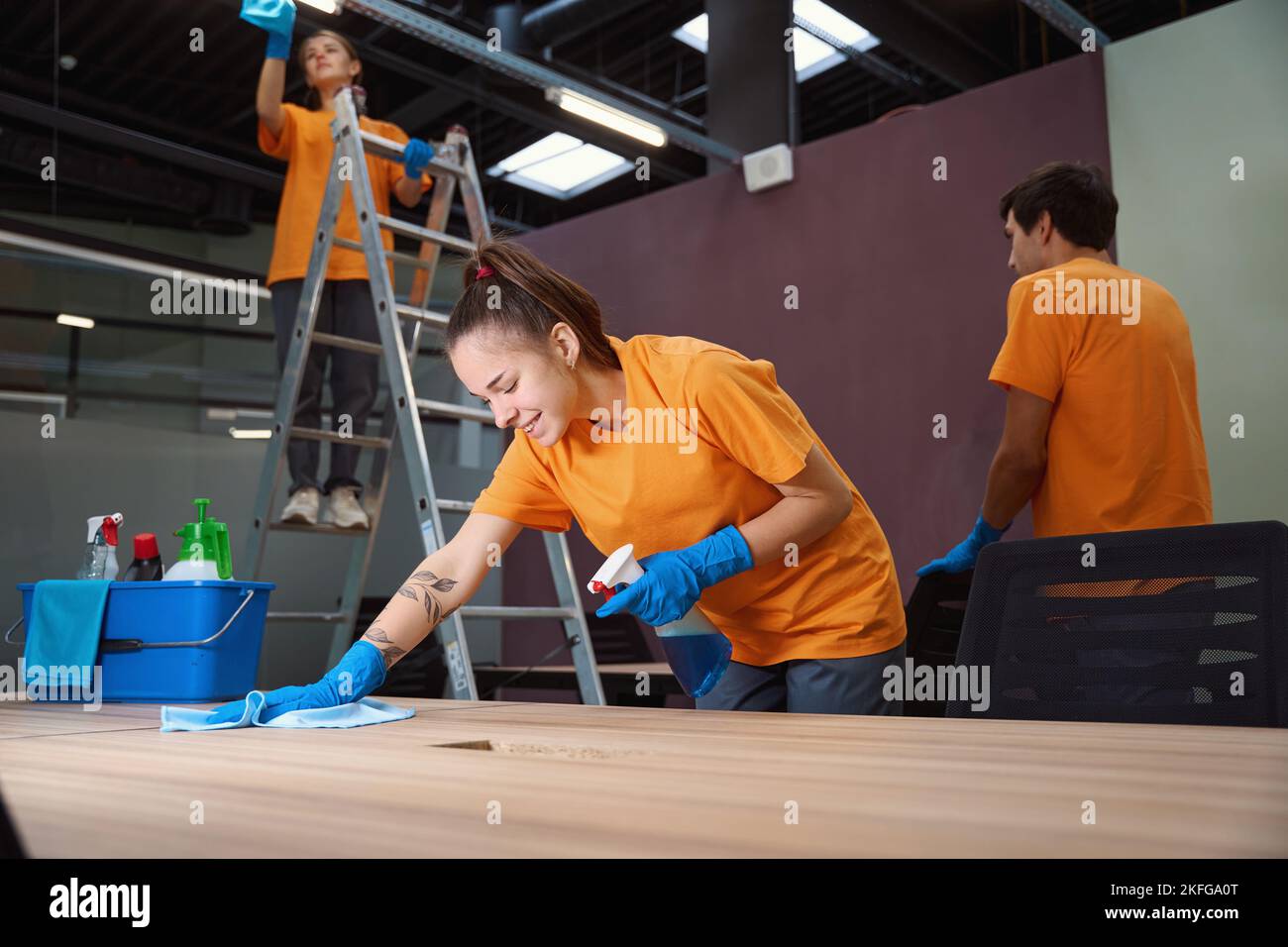 Certified team of cleaners are wiping surfaces and tidying up Stock ...