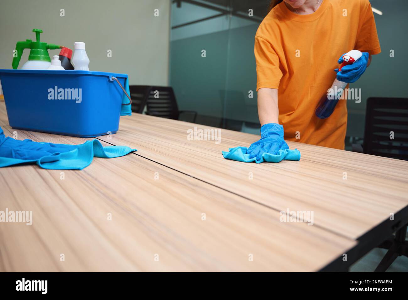 Cleaning service employee working hard on wiping tabletop Stock Photo ...