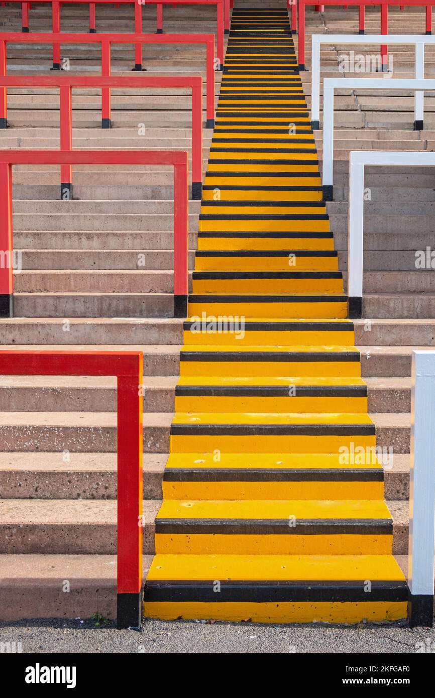 Colourful pattern composed of steps and safety barriers on the terraces ...