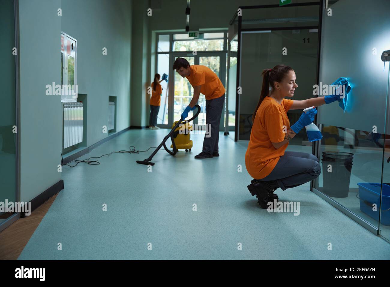 Team of certified janitors doing their best to clean building Stock ...
