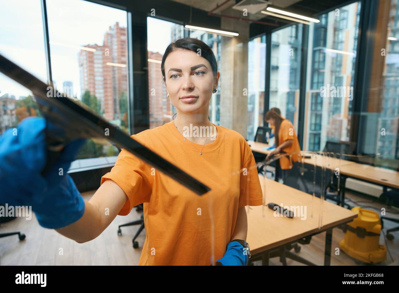 Cleaning company workers use different gadgets while cleaning and ...