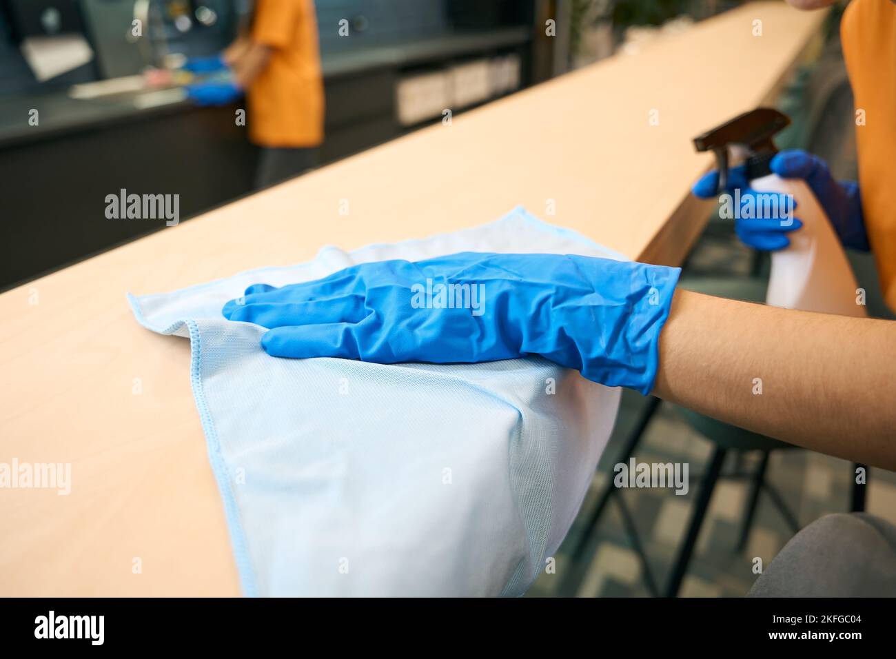 Cleaning company employees in uniform clean and disinfect surfaces ...