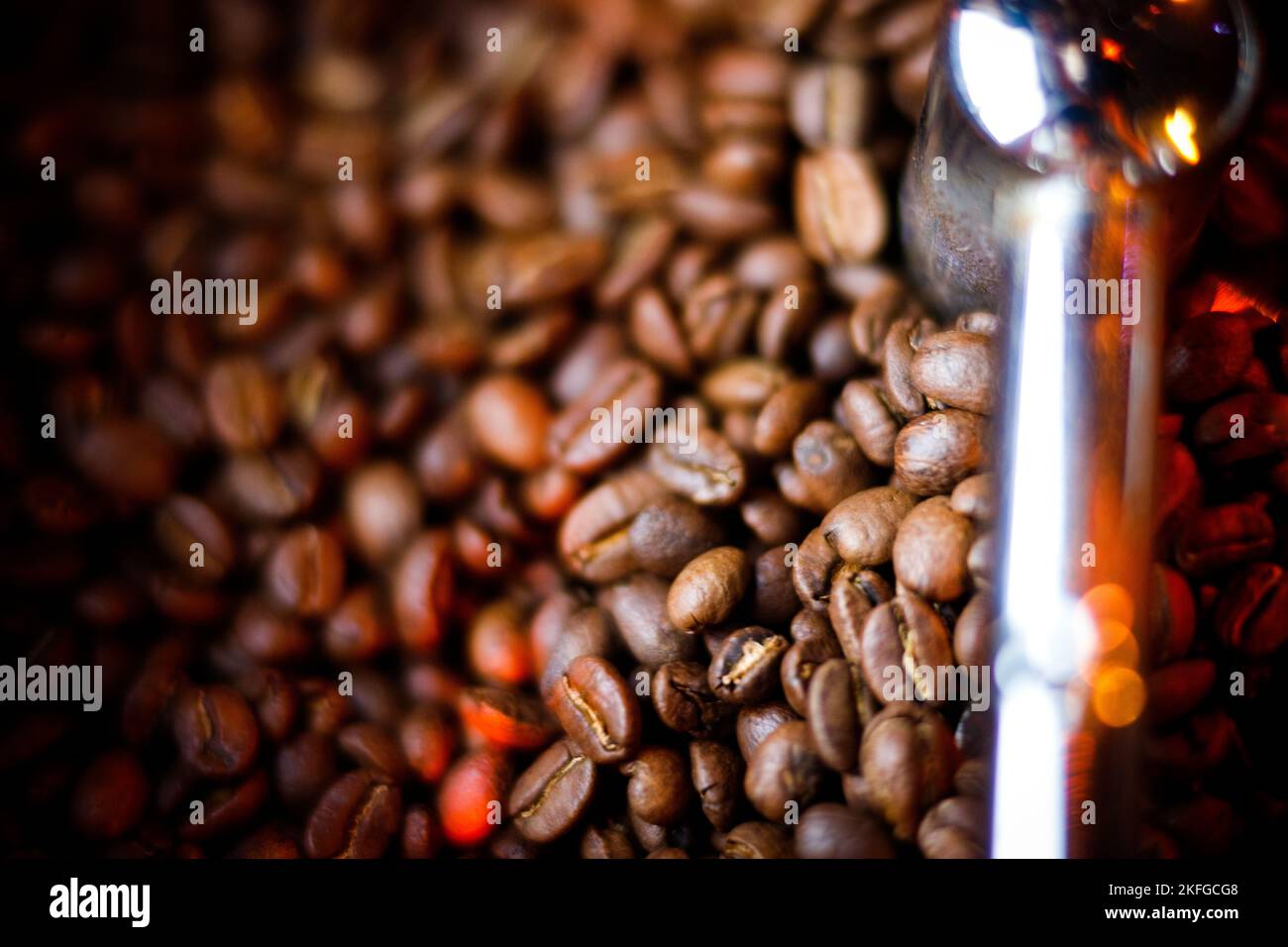 Coffee beans in a coffee machine, in dark colors Stock Photo - Alamy