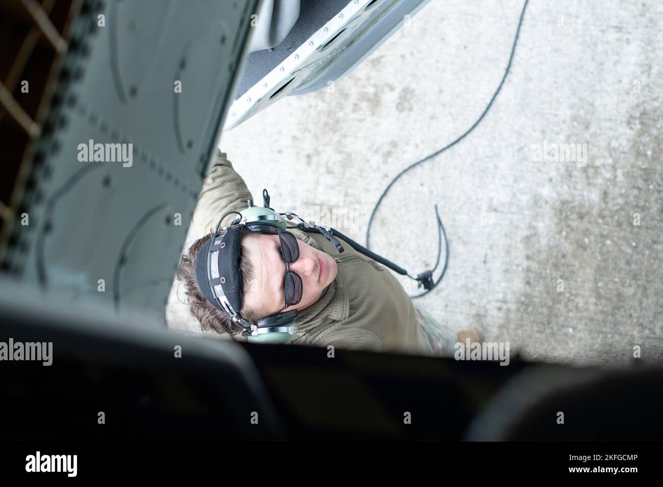 A crew chief assigned to the 718th Aircraft Maintenance Squadron closes ...
