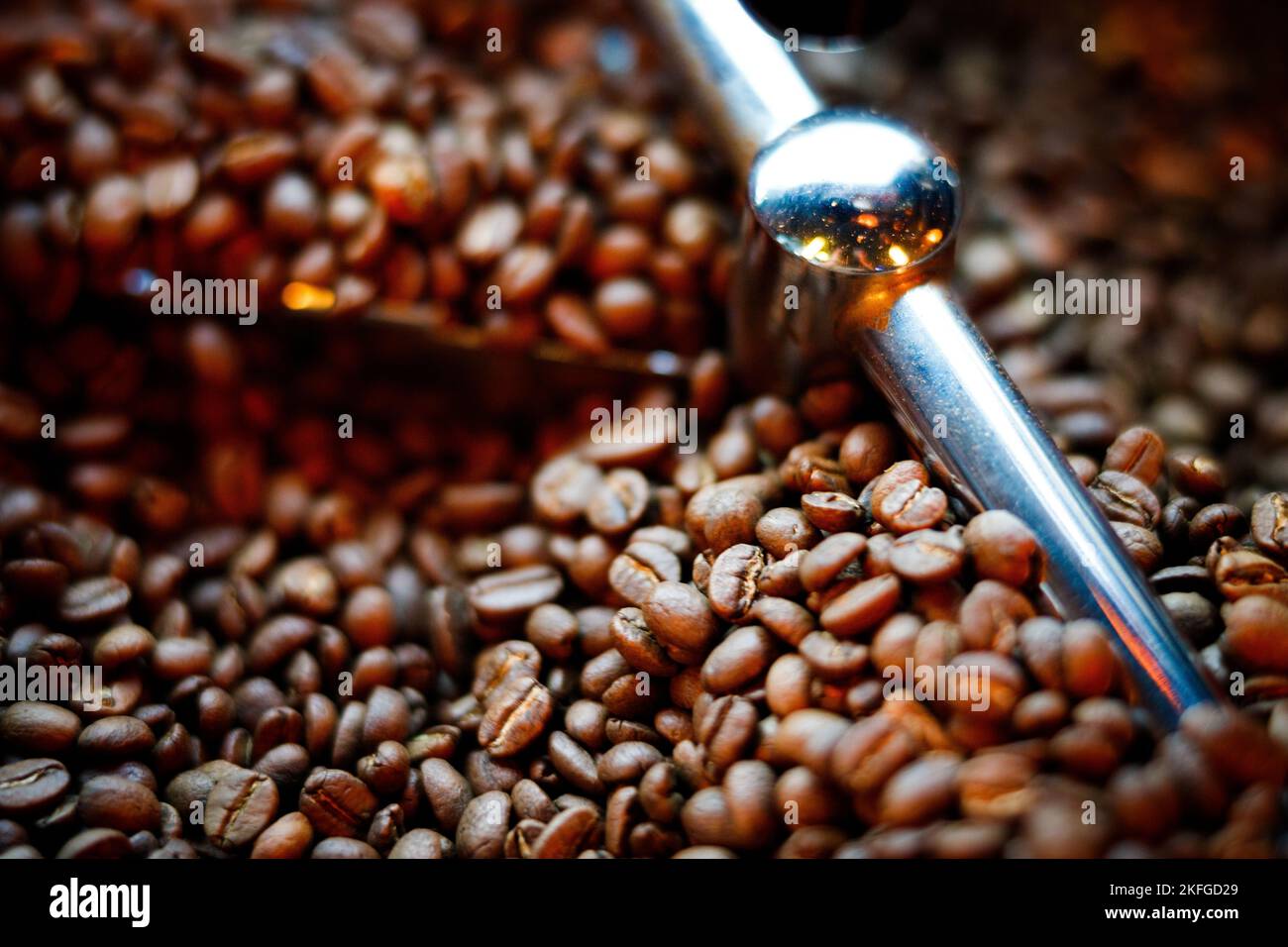 Coffee beans in a coffee machine, in dark colors Stock Photo - Alamy