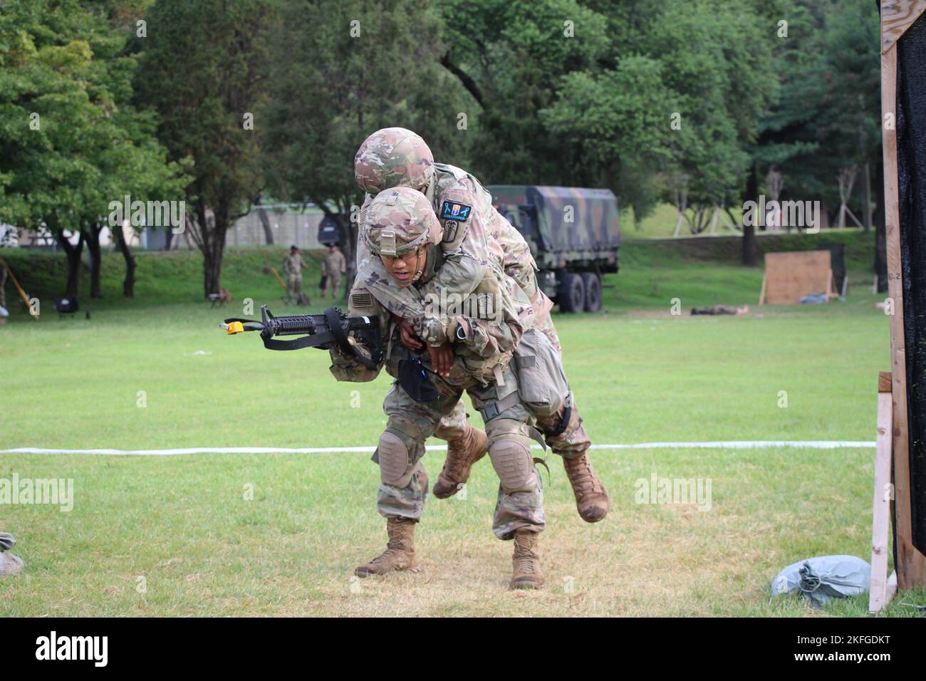 EFMB Candidate conducts the one person carry with weapon during the ...