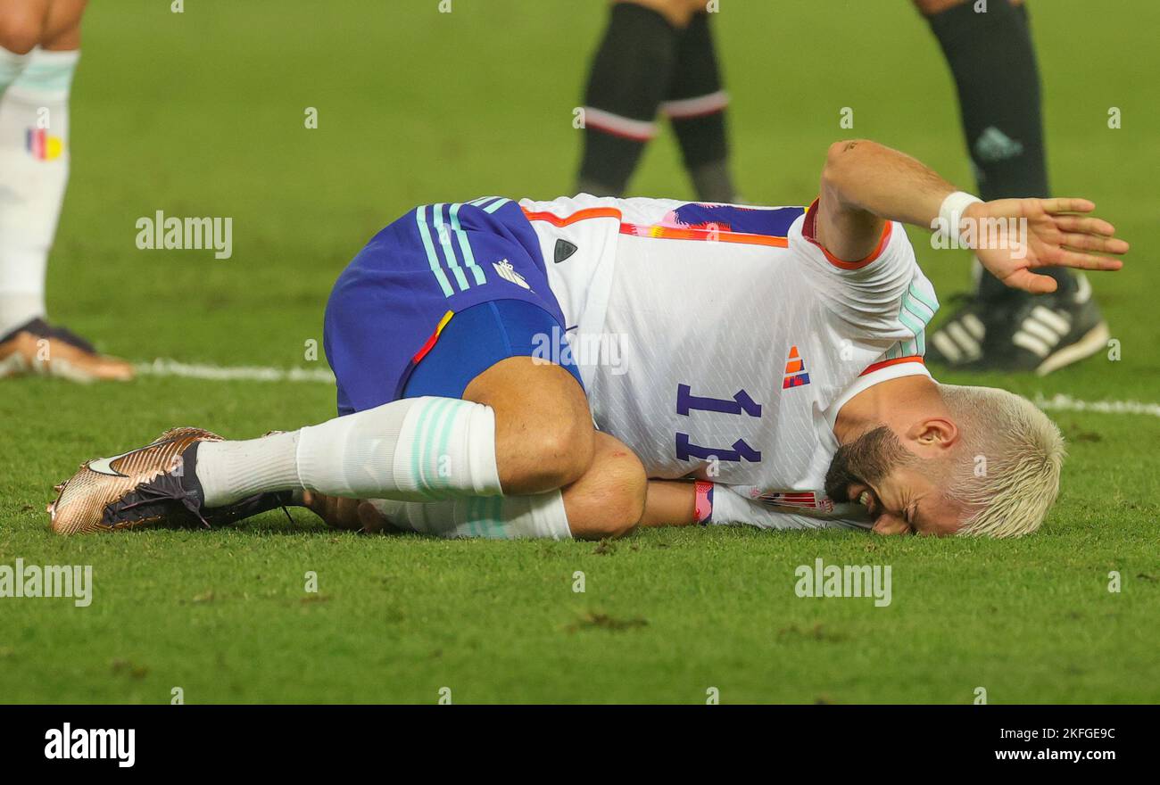 Belgium's Yannick Carrasco lies injured on the ground during a friendly ...