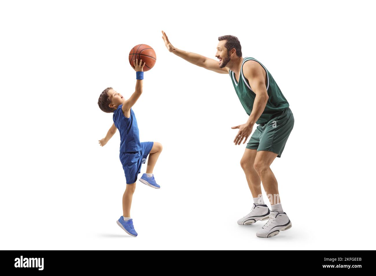 Full length profile shot of an adult basketball player playing ...