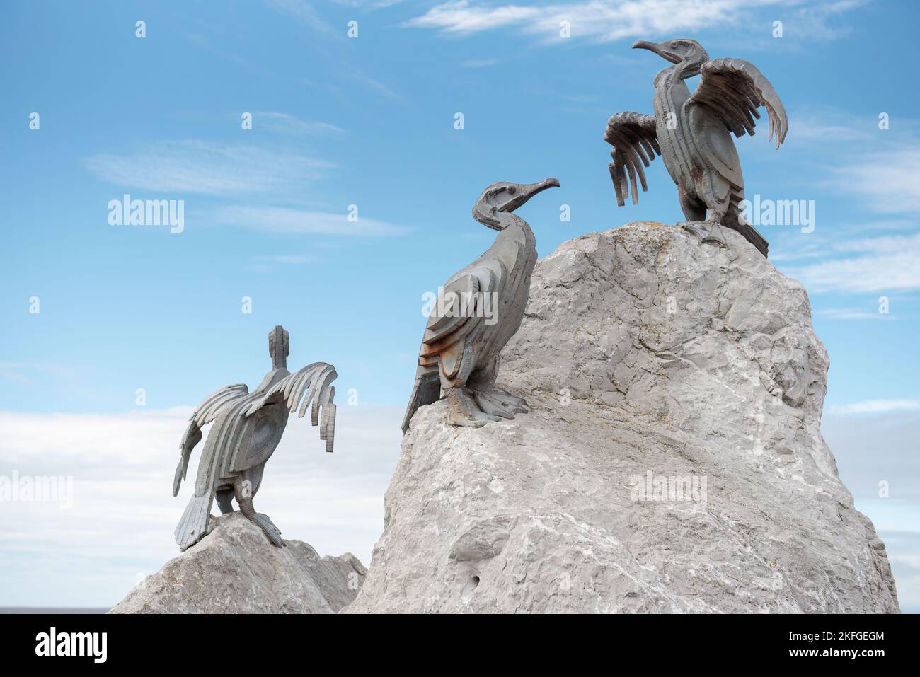Morecambe Bay sea front. Three metal art sculptures of cormorants sat ...