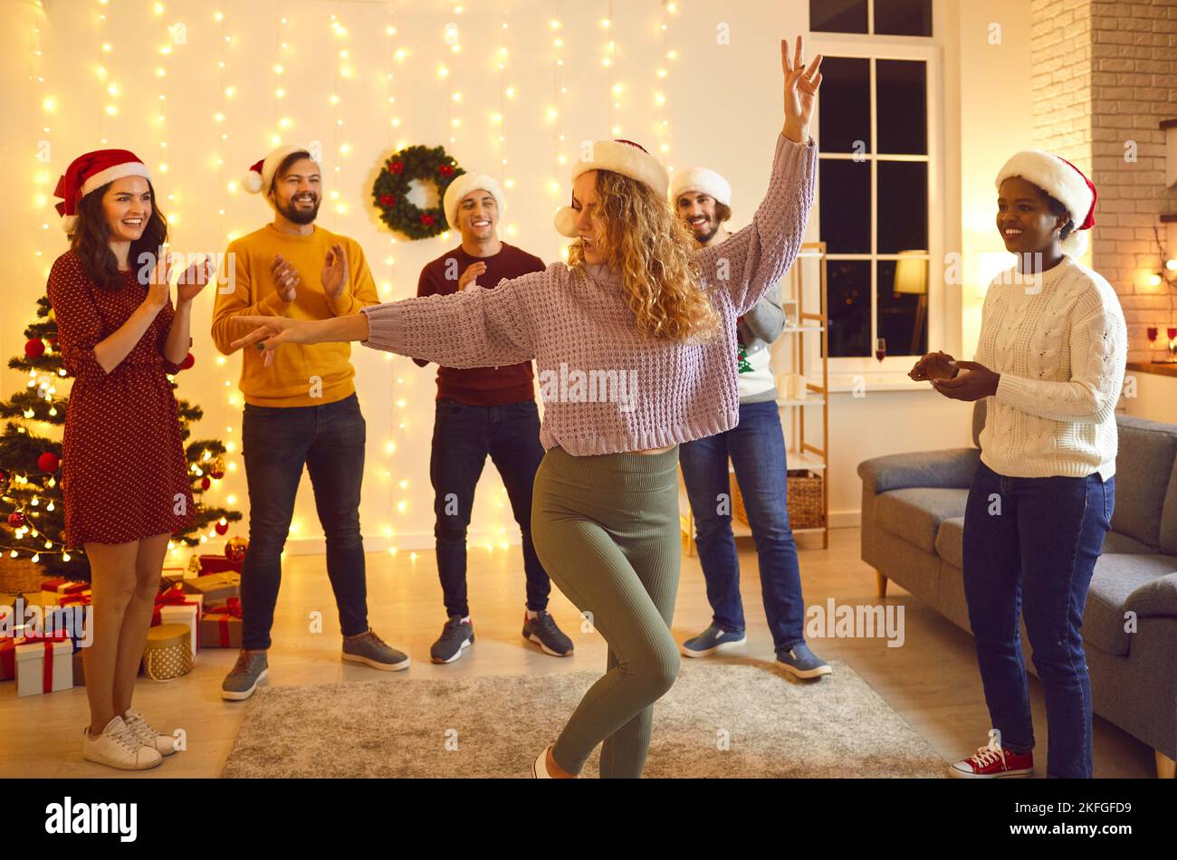Group of happy multiracial friends dancing and having fun at Christmas ...