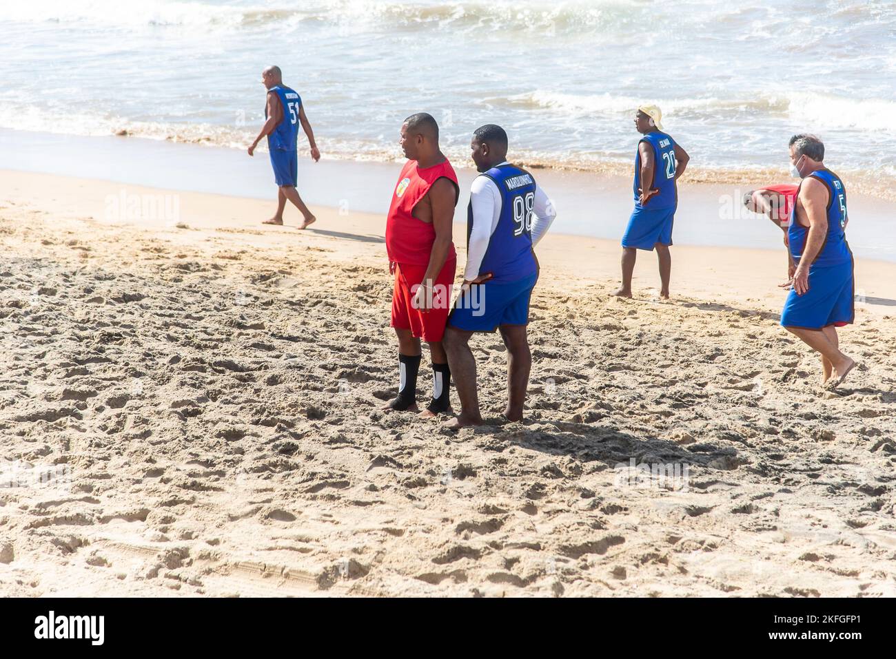 Group of men on the beach hi-res stock photography and images - Alamy